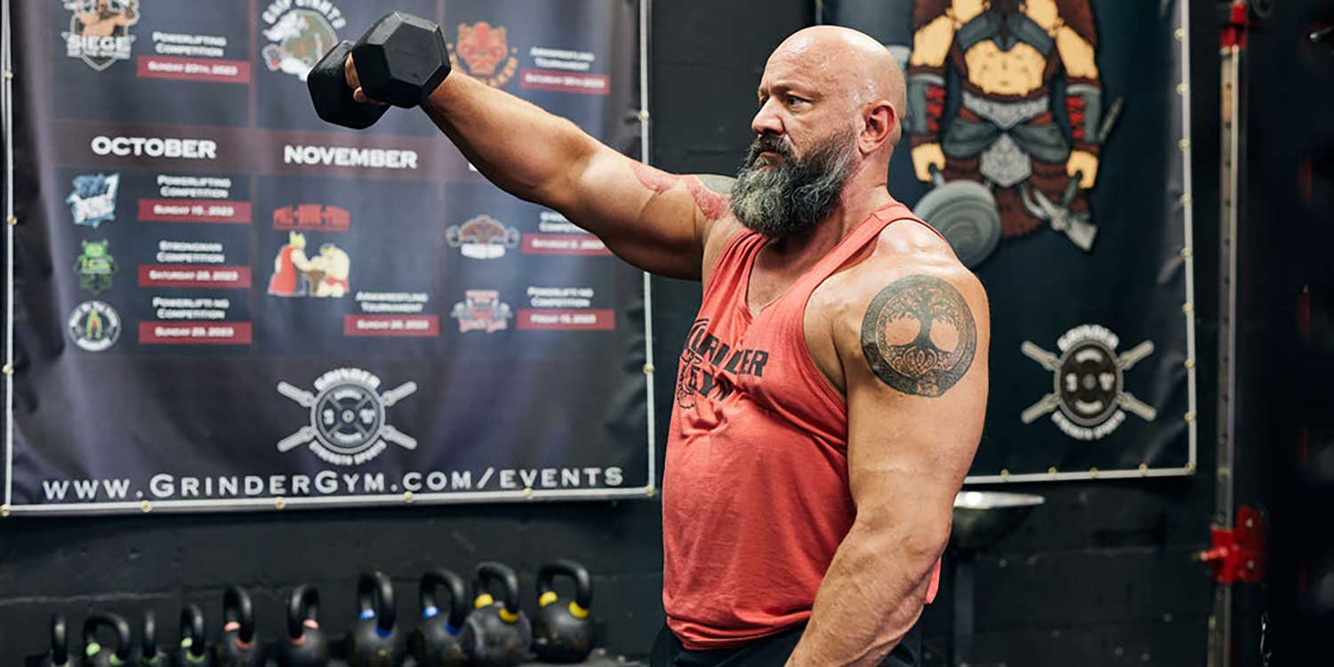 Dumbbell Single-Arm Front Raise – Grinder Gym